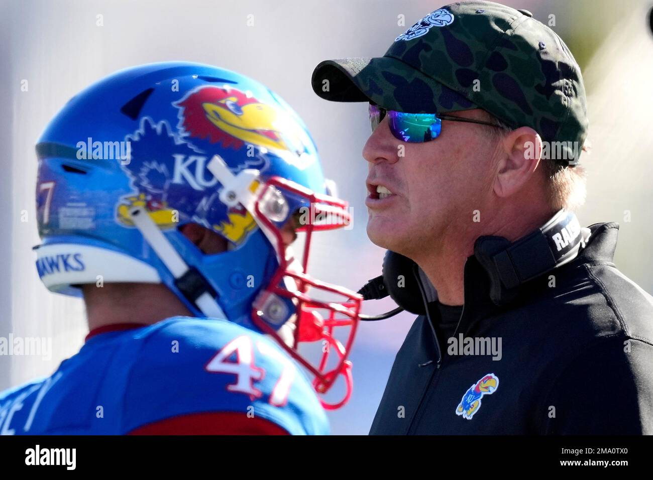 Kansas head coach Lance Leipold talks to his players during the first ...