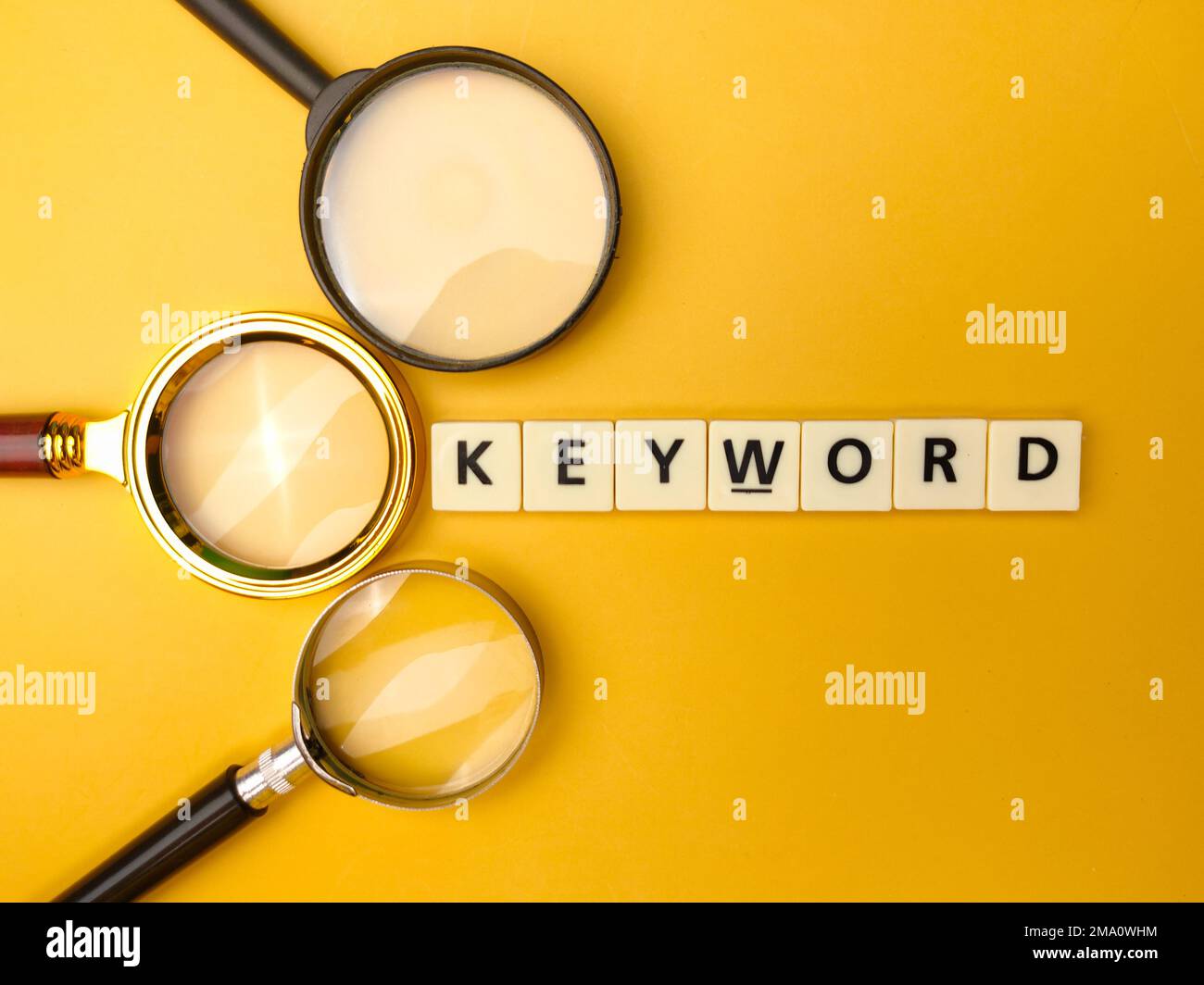 Magnifying glass and toys word with the word KEYWORD on yellow ...