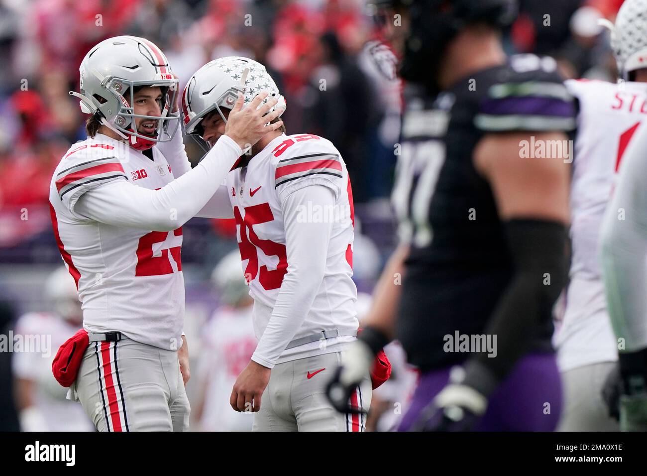 Ohio State place kicker Noah Ruggles (95) celebrates with punter Jesse ...