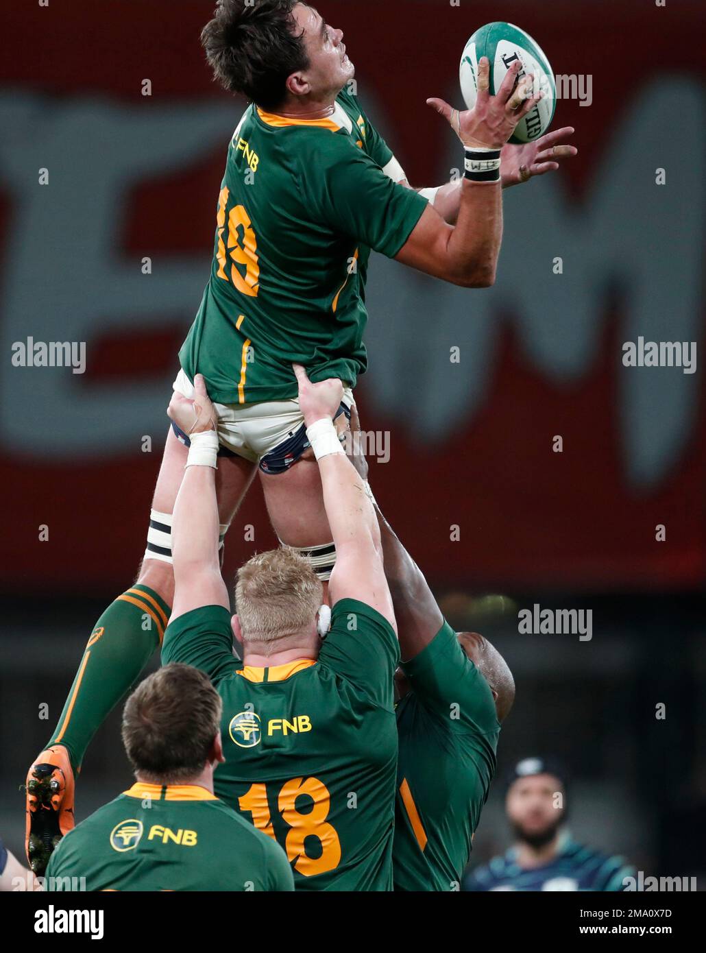 South Africa's Franco Mostert, top, jumps for the ball during a line ...