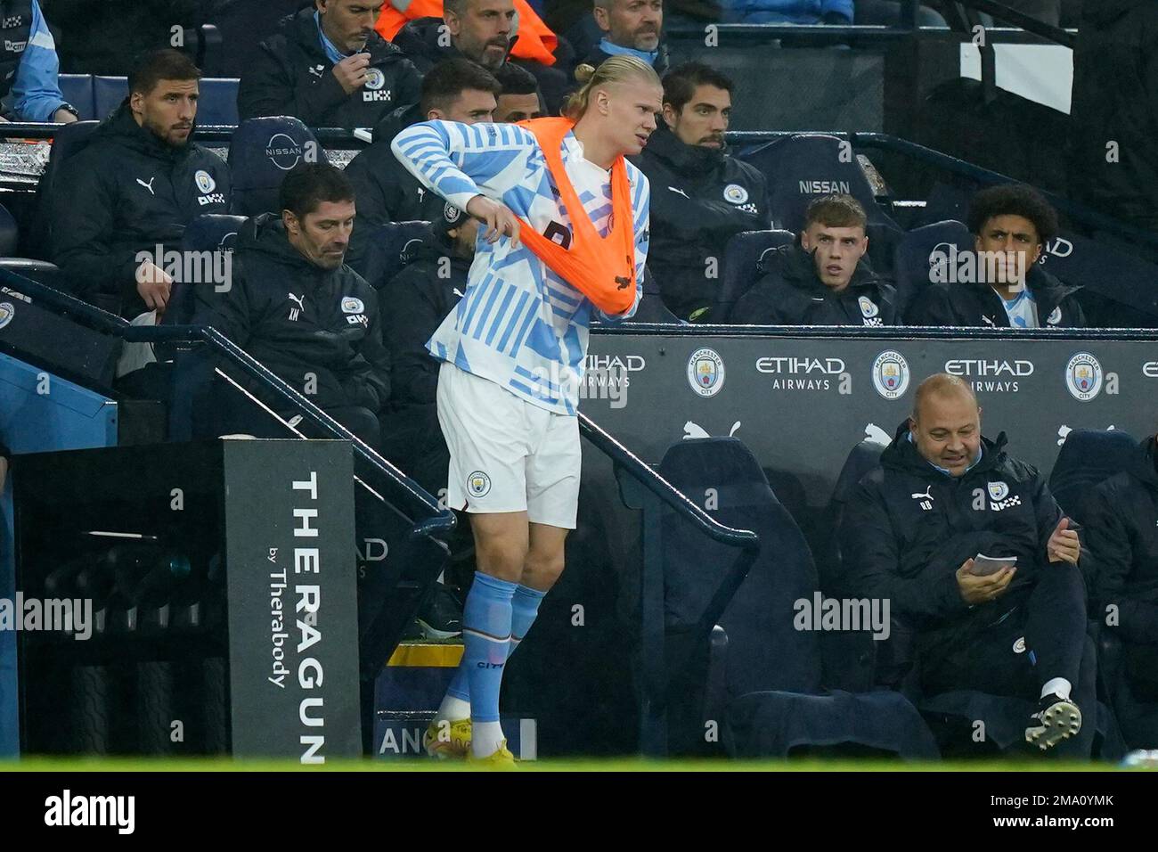 Manchester City's Erling Haaland gets off the bench to warm up during ...