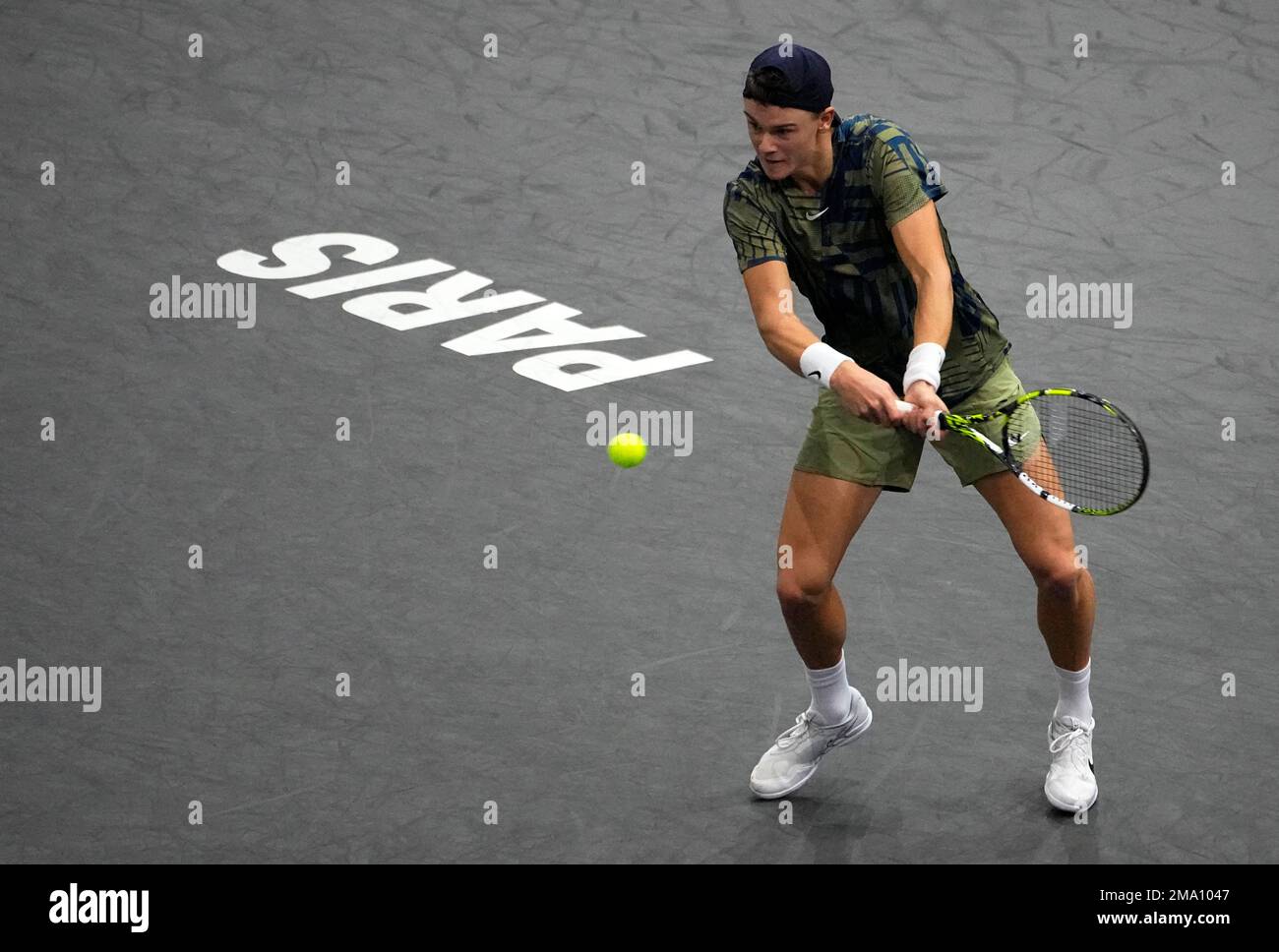 Holger Rune from Denmark returns the ball to Felix Auger-Aliassime of Canada during their semi ...