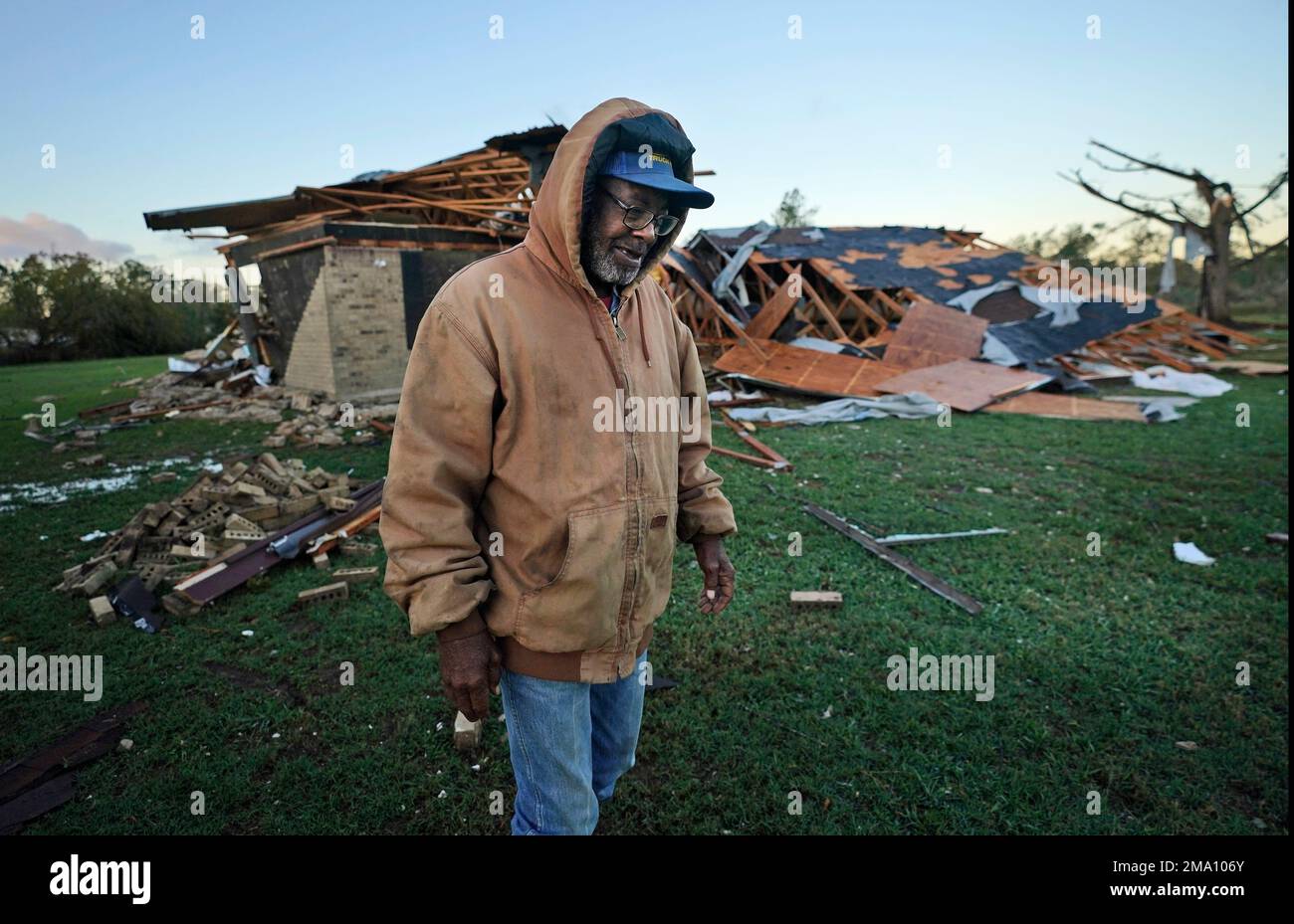 Willie Meeds walks from a relative's home after helping turn off the ...