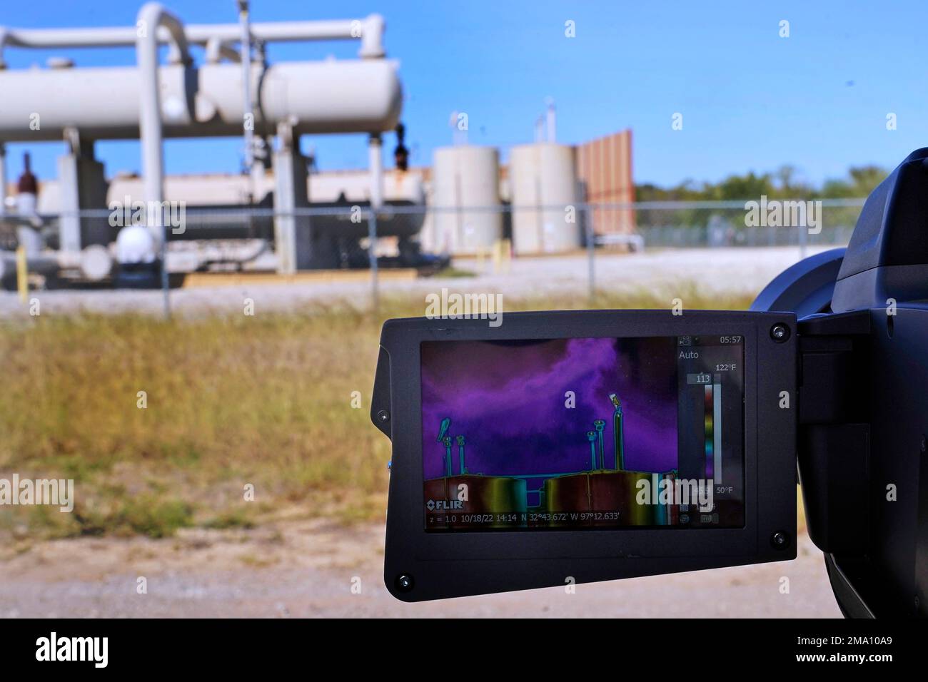 The screen on a thermal imaging camera shows methane leaking from tanks ...