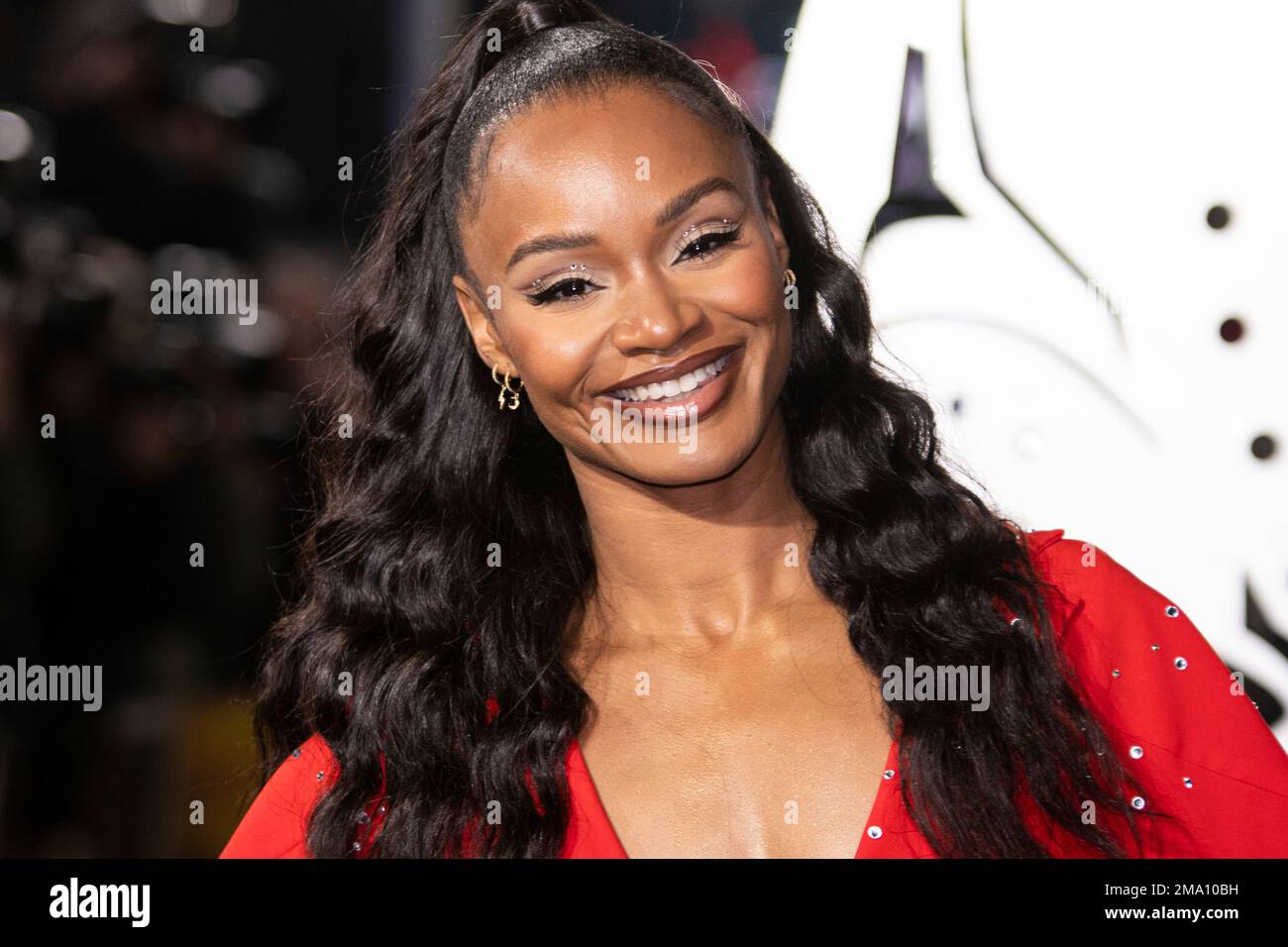 Imani-Lara Lansiquot poses for photographers upon arrival for the ...