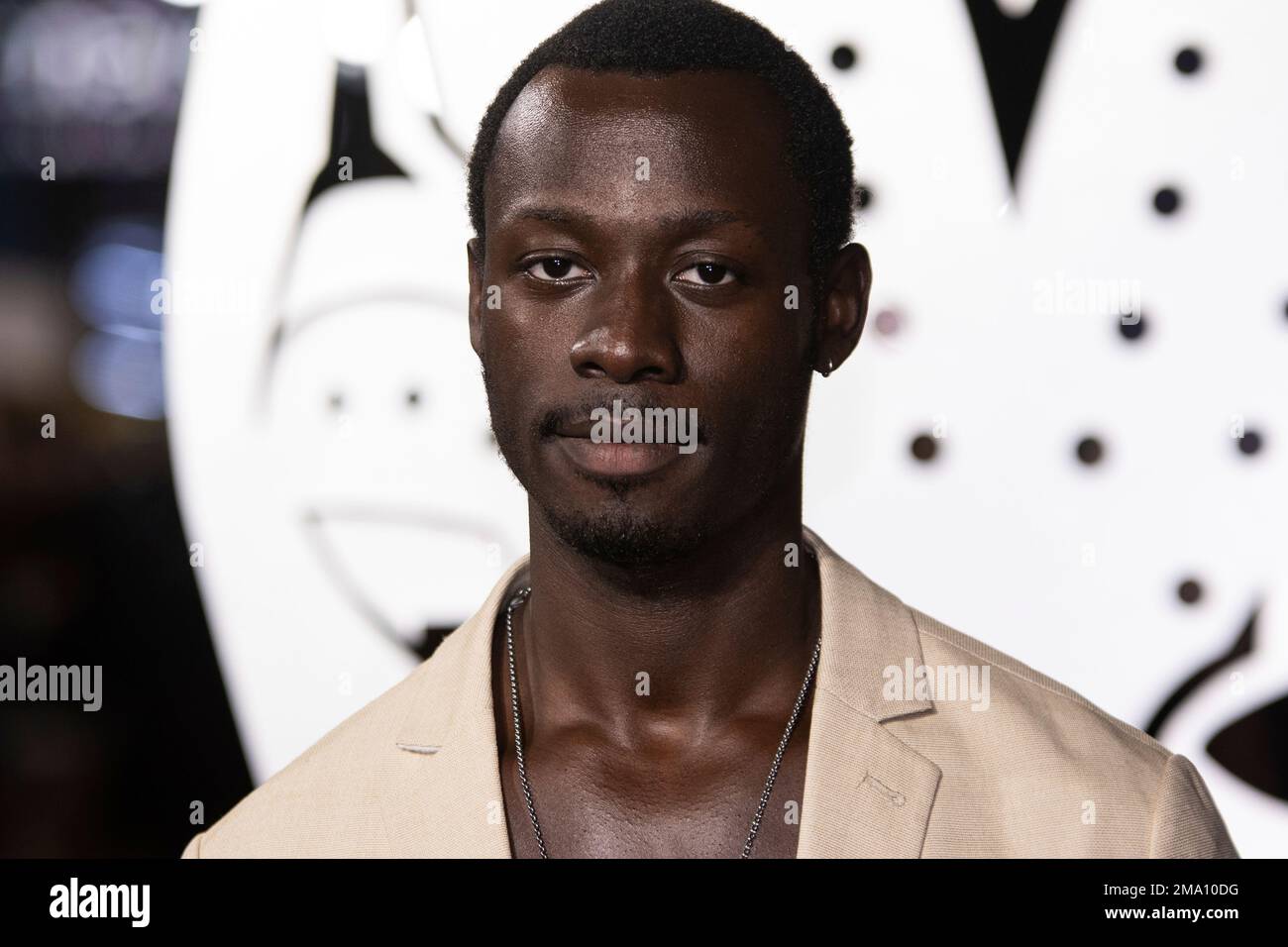 David Larbi poses for photographers upon arrival for the premiere of ...