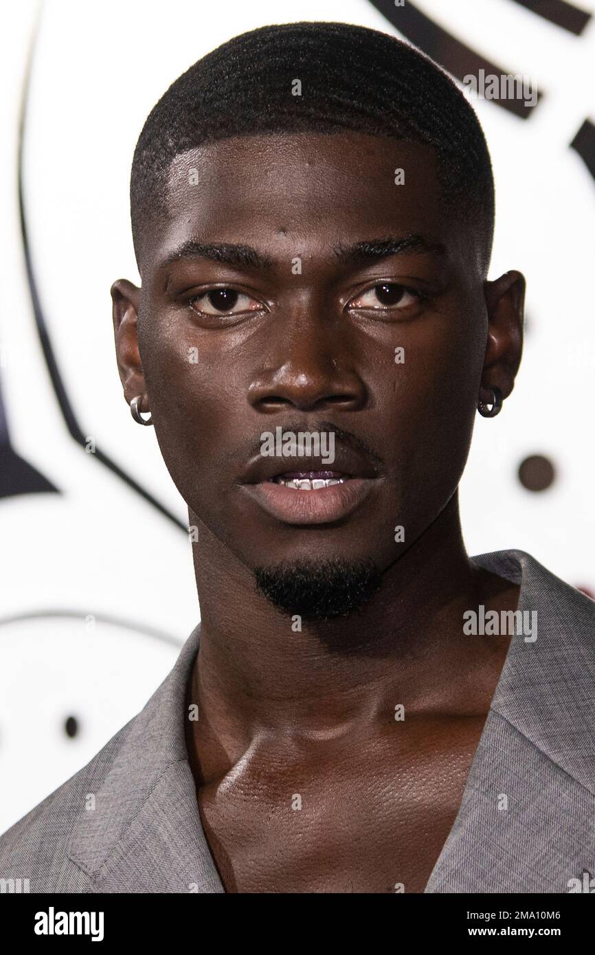 Victor Kunda poses for photographers upon arrival for the premiere of ...