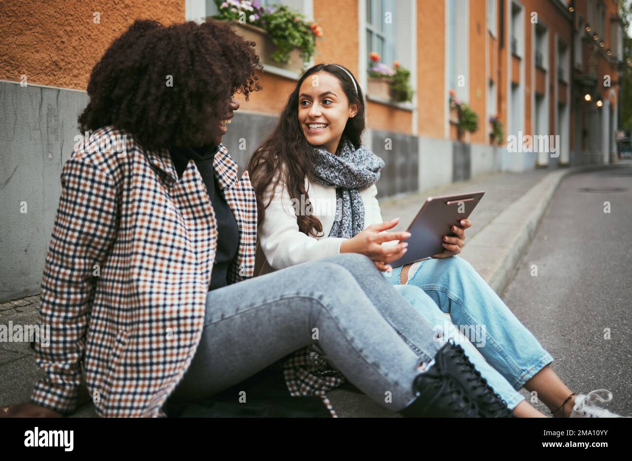 Street, friends and women talking, tablet and social media for ...