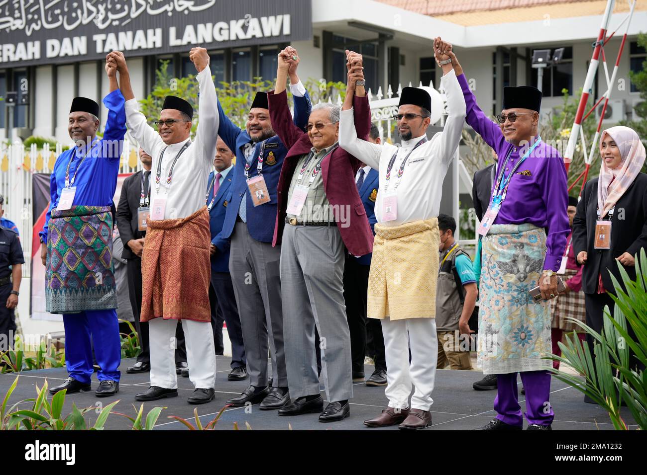Malaysia's former Prime Minister Mahathir Mohamad, center, chairman of ...