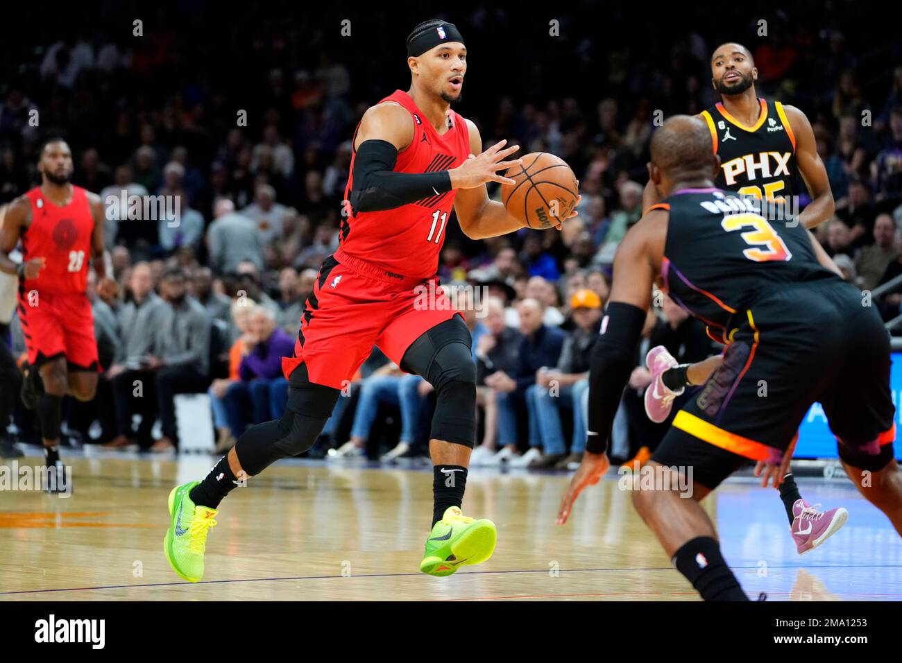 Portland Trail Blazers guard Josh Hart (11) drives against the Phoenix ...