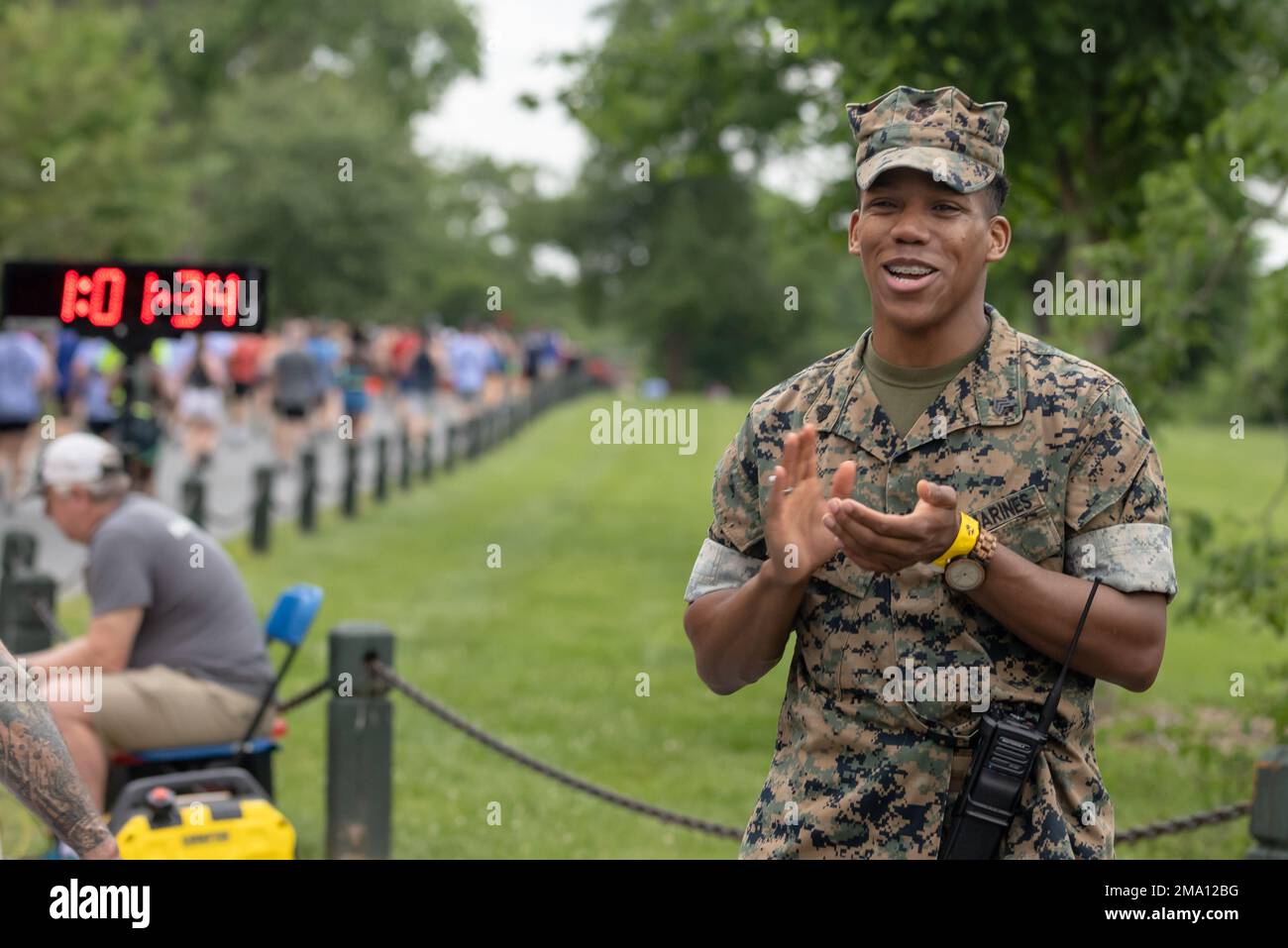 U.S. Marine Corps Sgt. Kershon Manciel motivates race participants ...