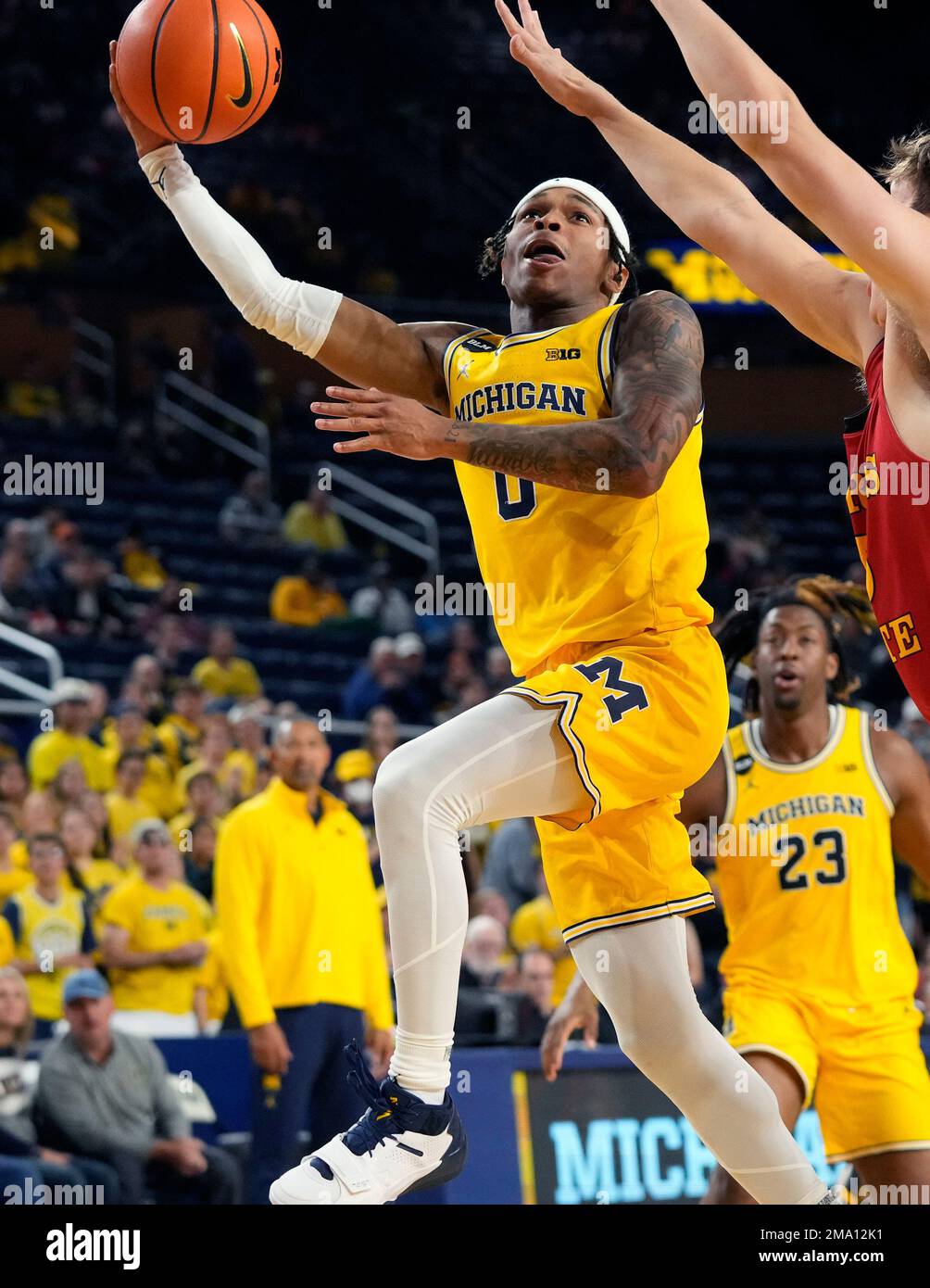 Michigan guard Dug McDaniel makes a layup during the second half of an ...