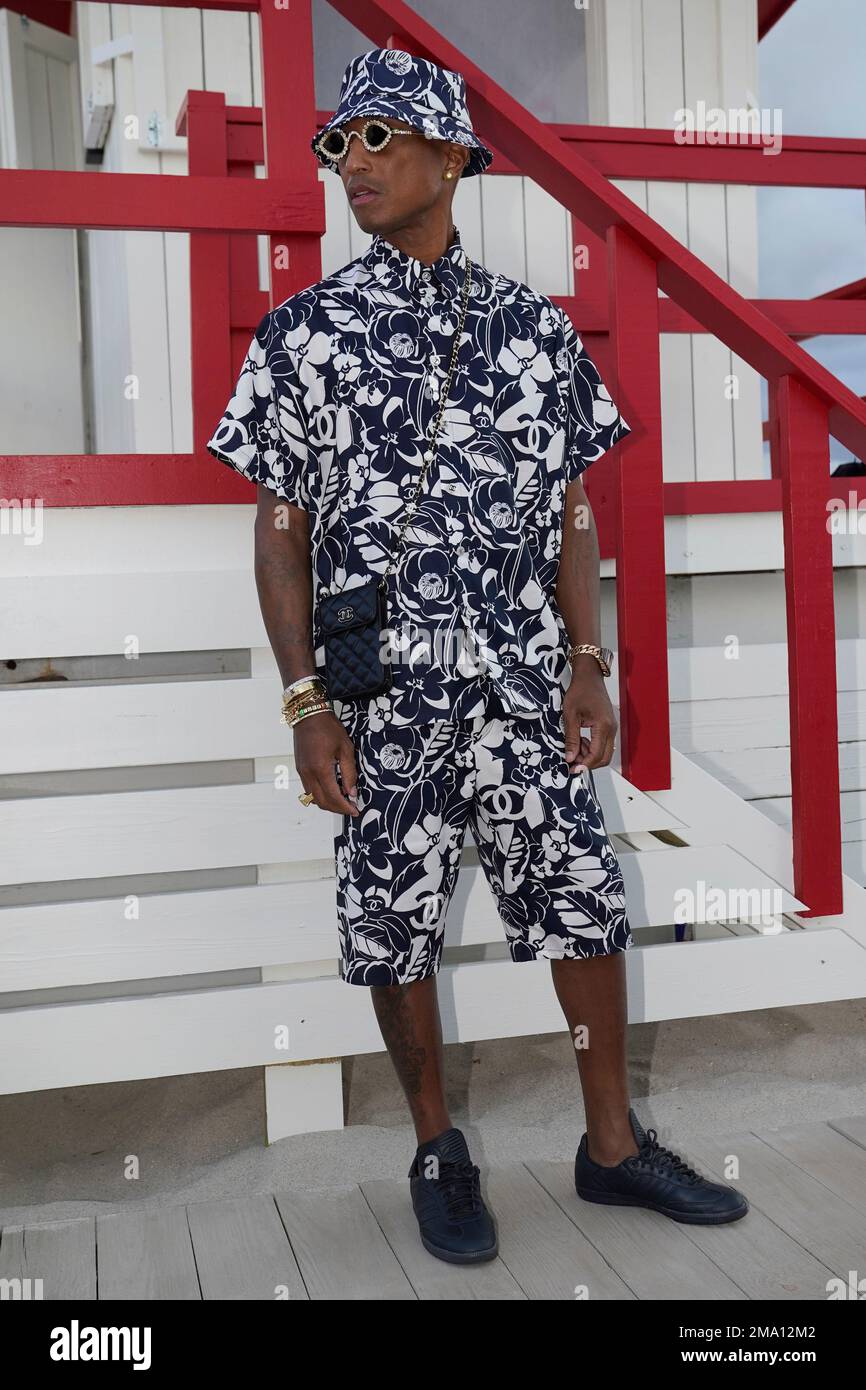 Pharrell Williams poses for a photograph at the Chanel Cruise 2022/23 ...