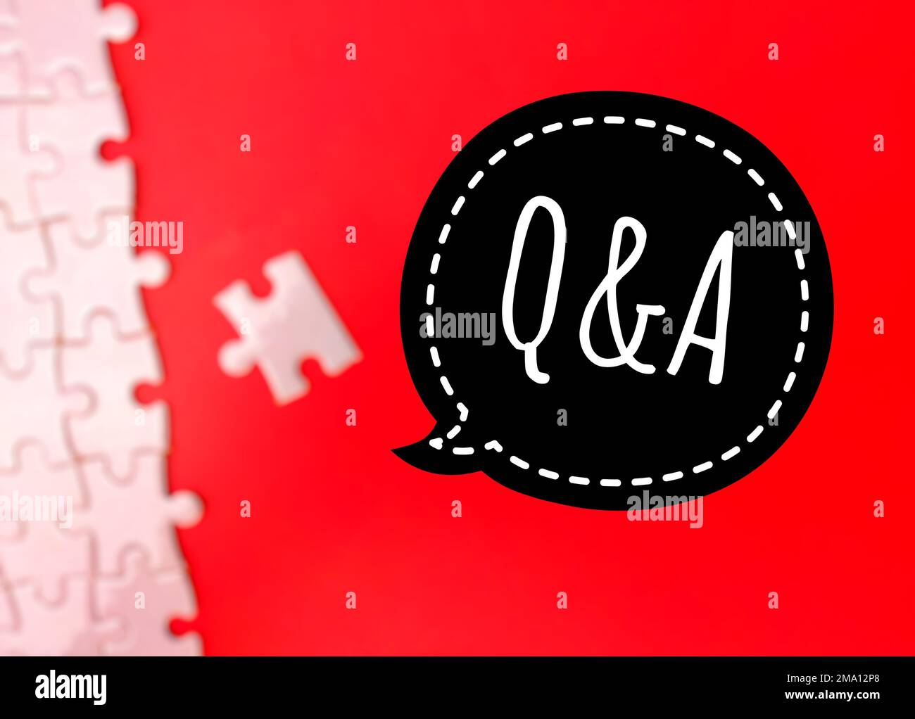 Blur Unfinished white jigsaw puzzle pieces on red background with the word Q AND A Stock Photo ...