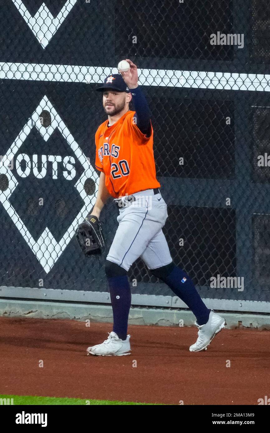 Houston Astros center fielder Chas McCormick holds up the ball after making the catch agains the ...