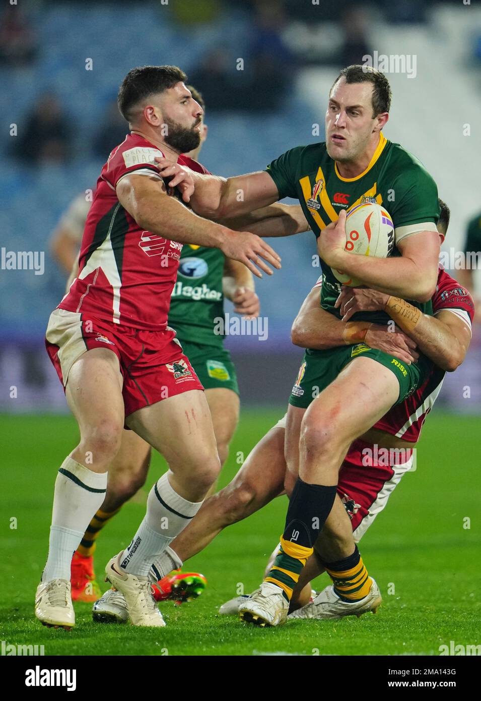 Australia's Isaah Yeo, right, is tackled by Lebanon's players during ...