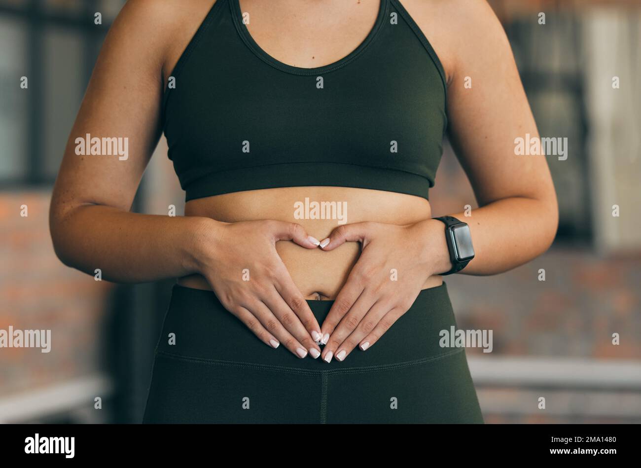 Closeup, woman and touch stomach, fitness and healthy lifestyle with ...