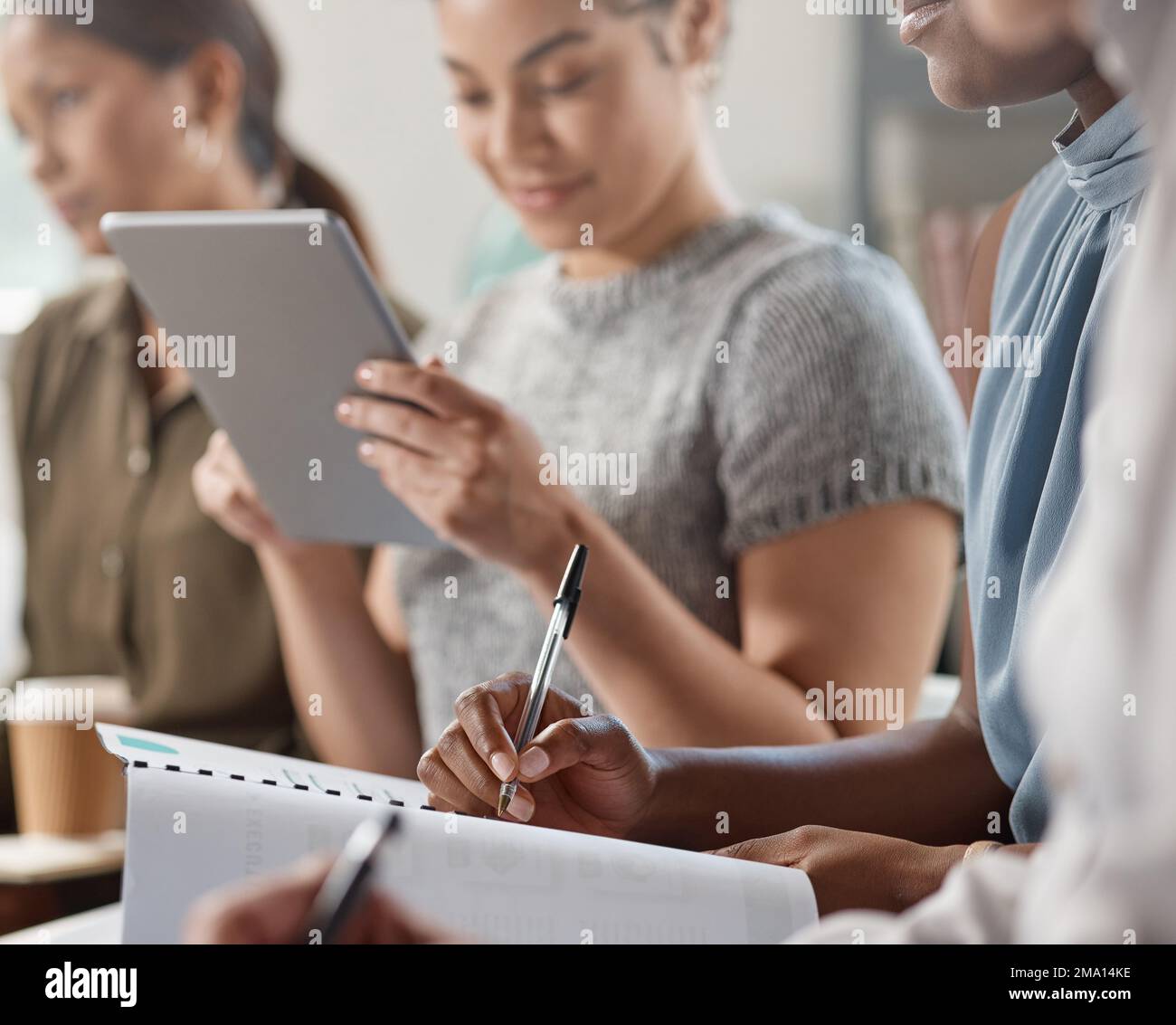 Ready to take down notes. an unrecognizable businessperson writing in a ...