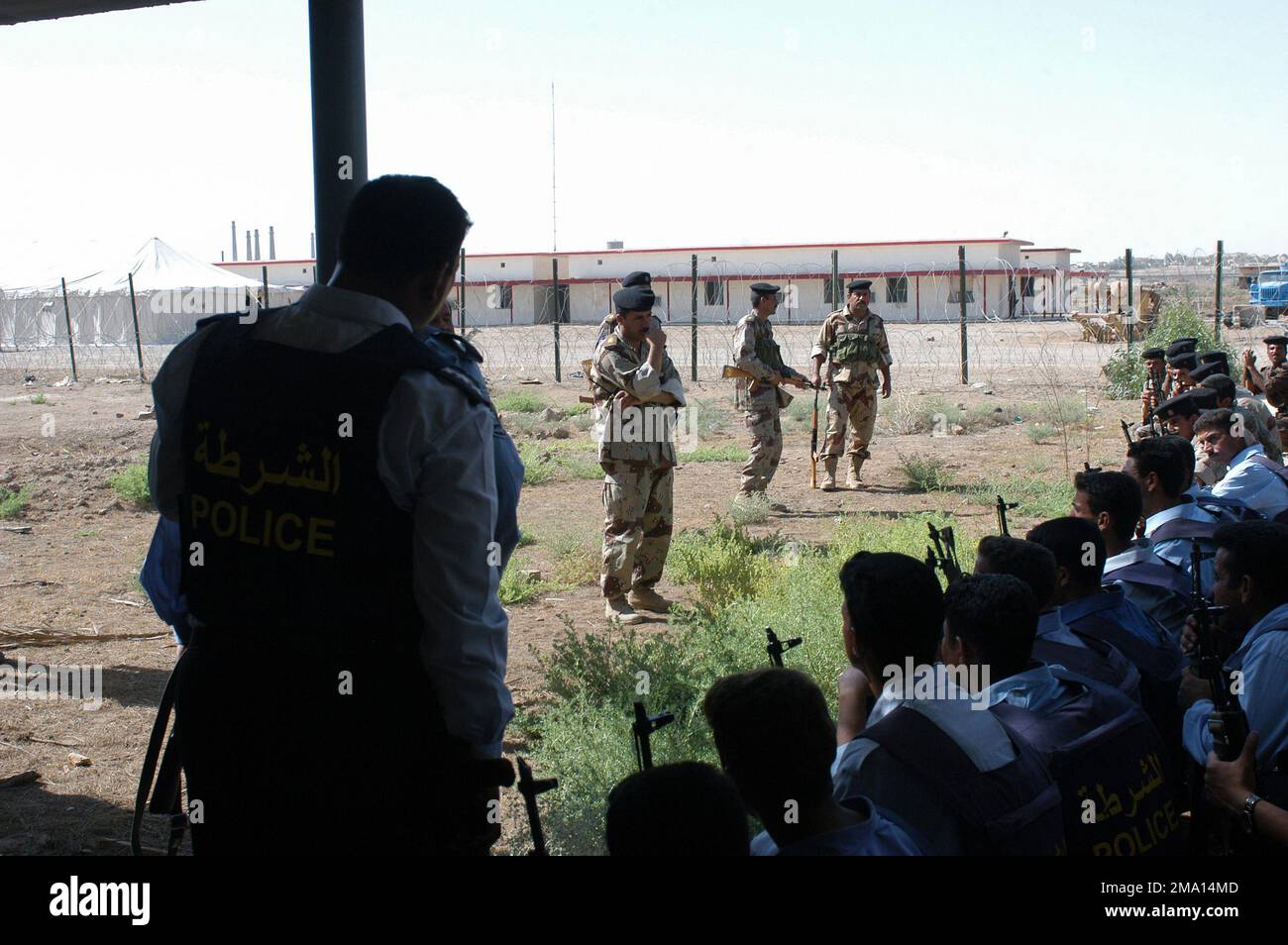 040606-M-5555L-115. [Complete] Scene Caption: Iraqi Civil Defense Corps ...
