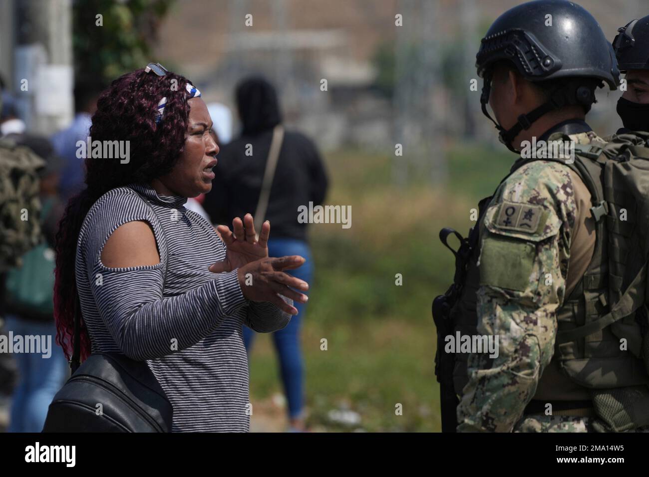 A woman ask about the status of an inmate outside La Roca prison ...