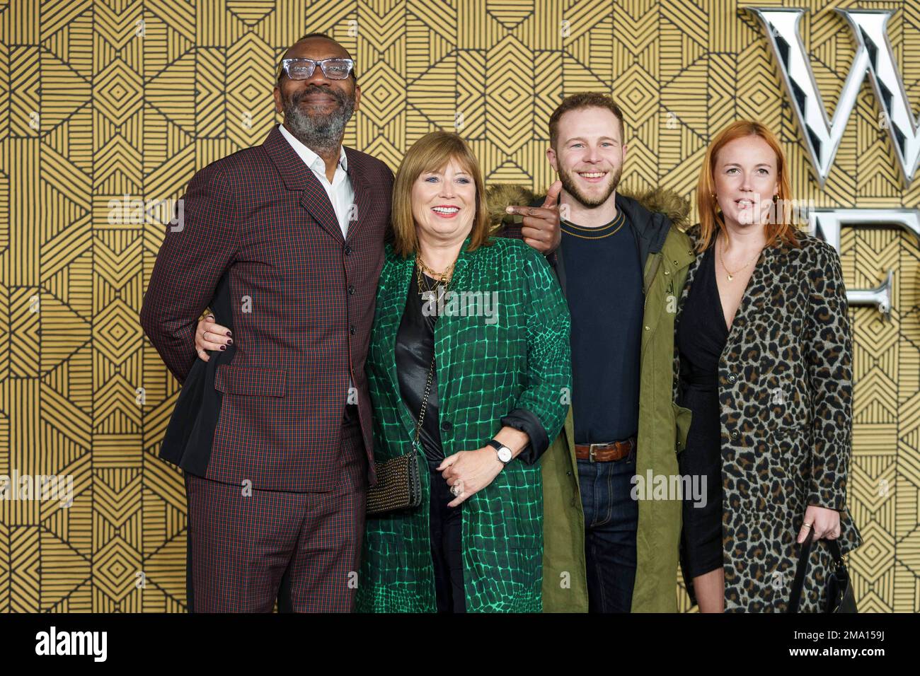 Sir Lenny Henry, left, Lisa Makin and guests pose for photographers ...