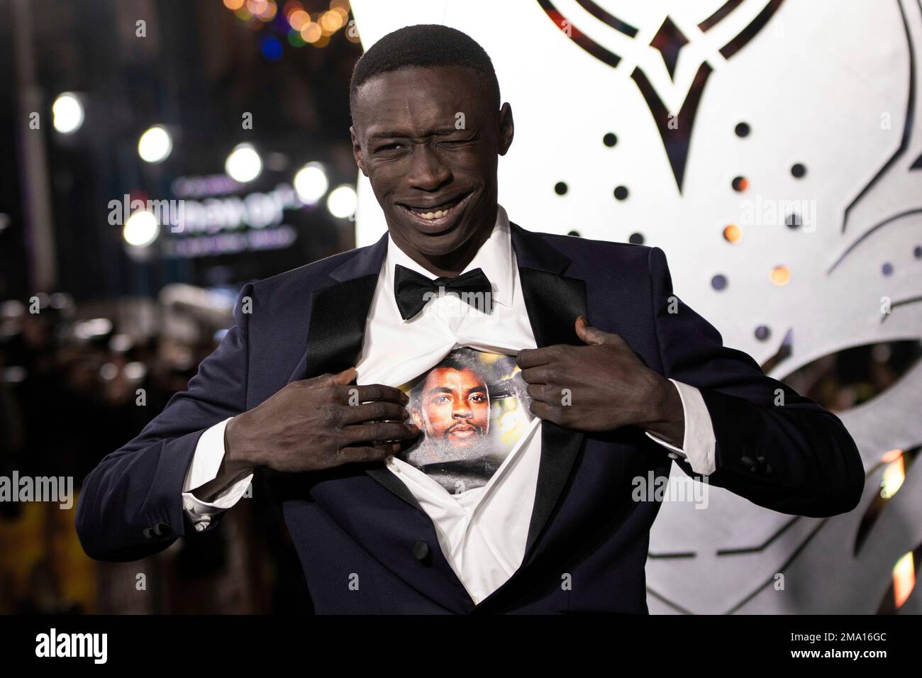 Khaby Lame opens his shirt to reveal the image of Chadwick Boseman upon ...