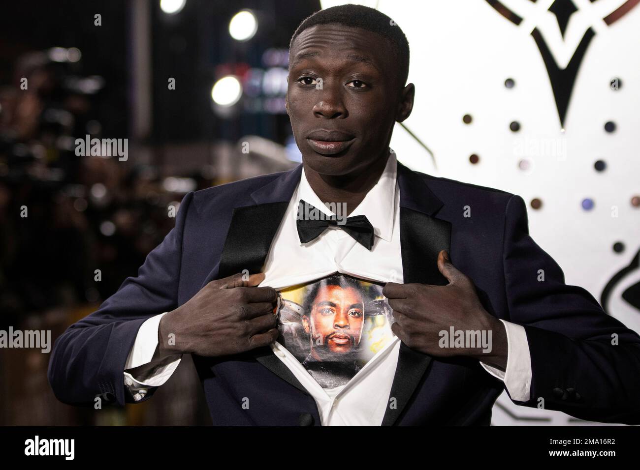Khaby Lame opens his shirt to reveal the image of Chadwick Boseman upon ...