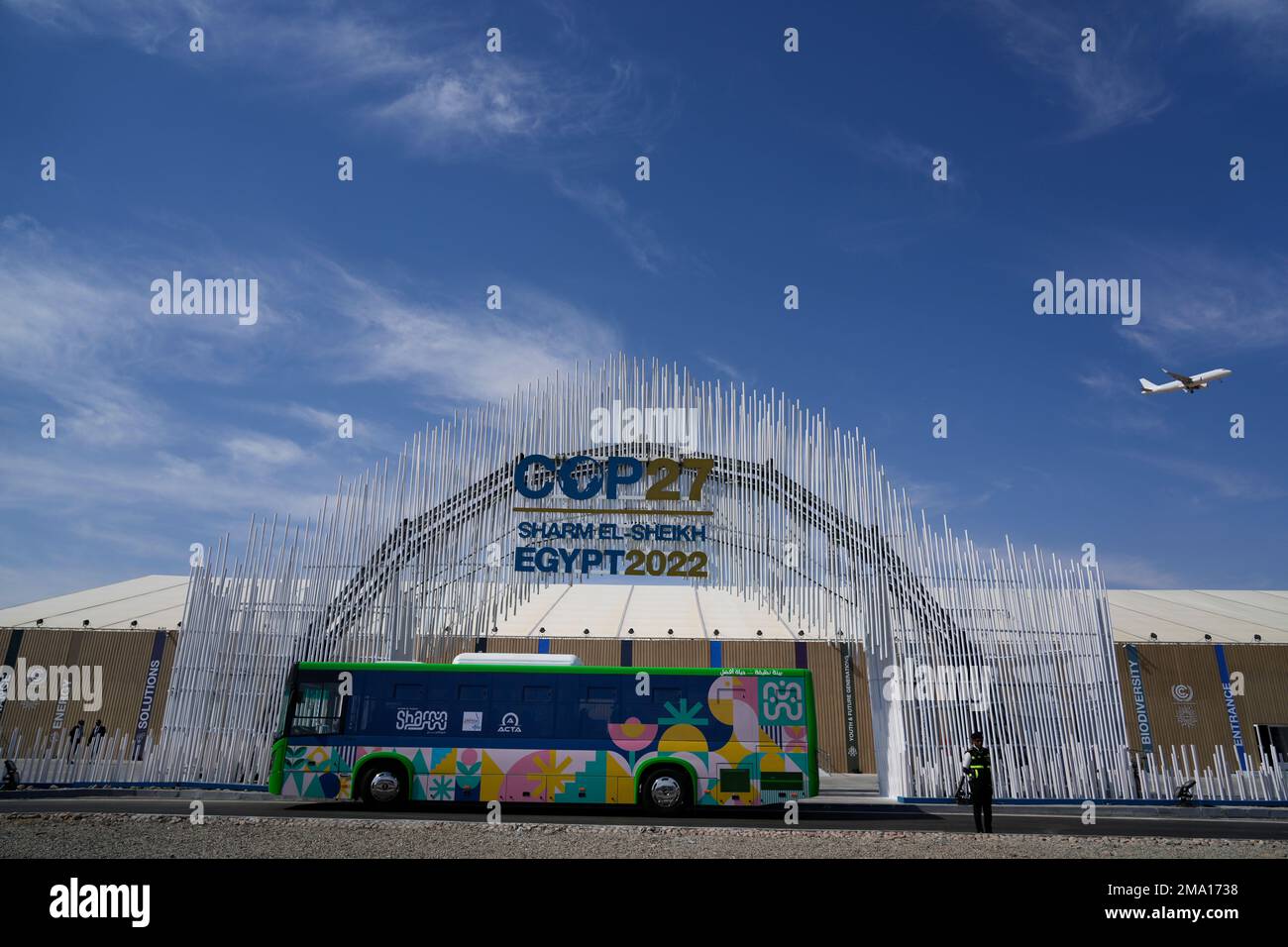An airplane takes off and flies over the convention center, Friday, Nov ...