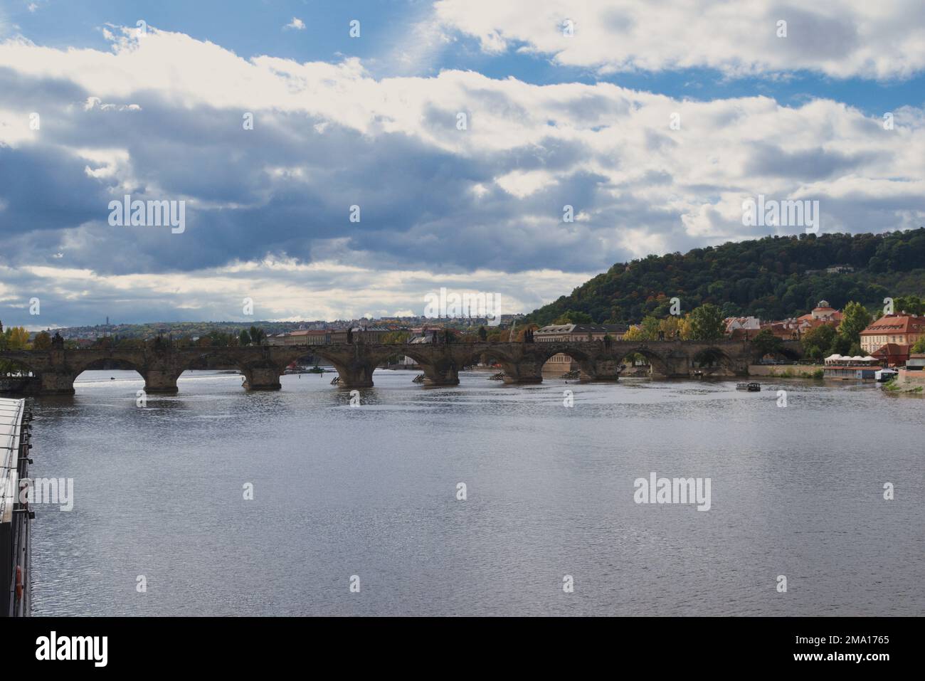A beautiful view of The Charles Bridge crossing the Vltava river in ...
