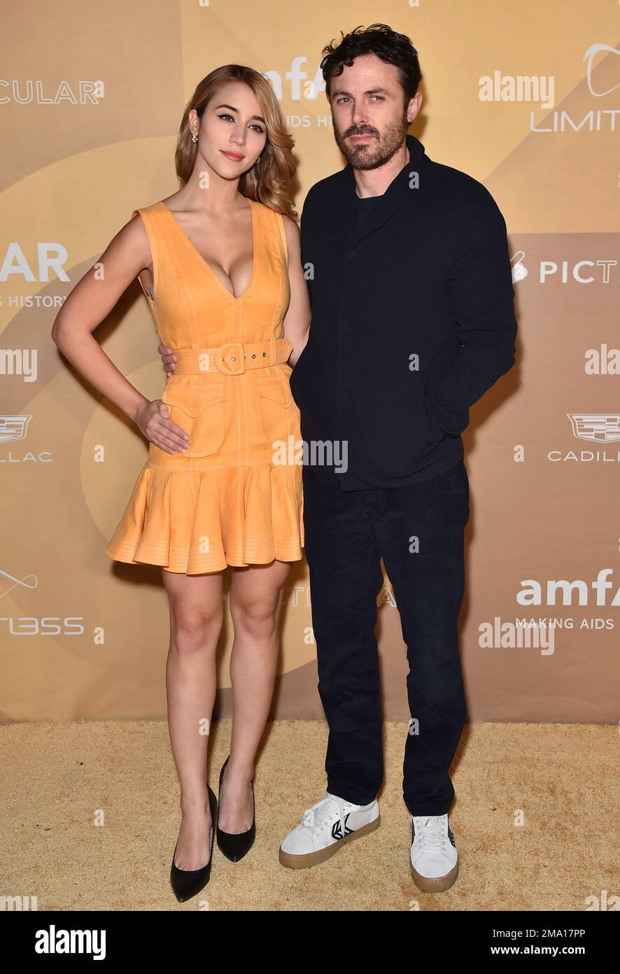 Caylee Cowan, left, and Casey Affleck arrive at the amfAR Gala Los ...