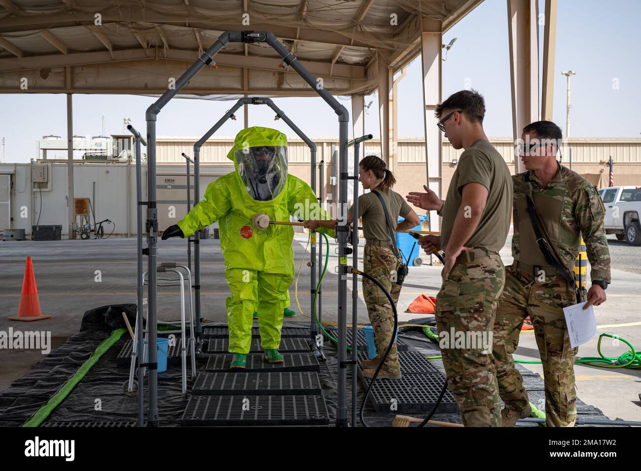 A U.S. Airman walks through a decontamination structure after ...