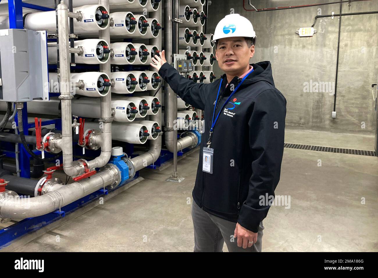 Sunny Wang, water resources manager for Santa Monica, gestures toward reverse osmosis membranes ...