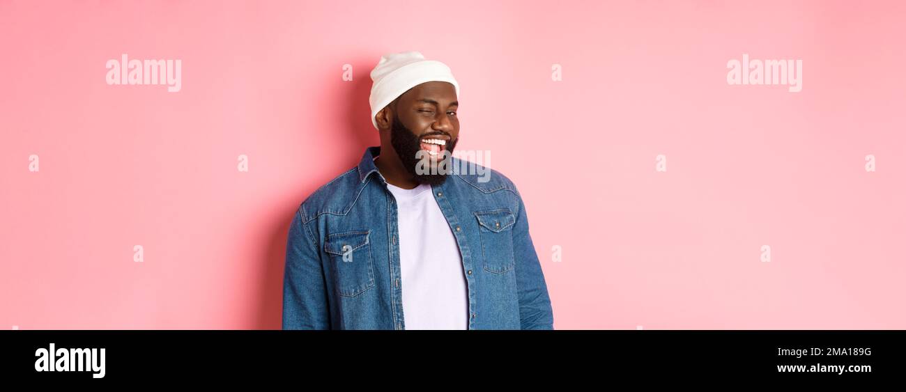 Cheerful african guy winking smiling hi-res stock photography and ...