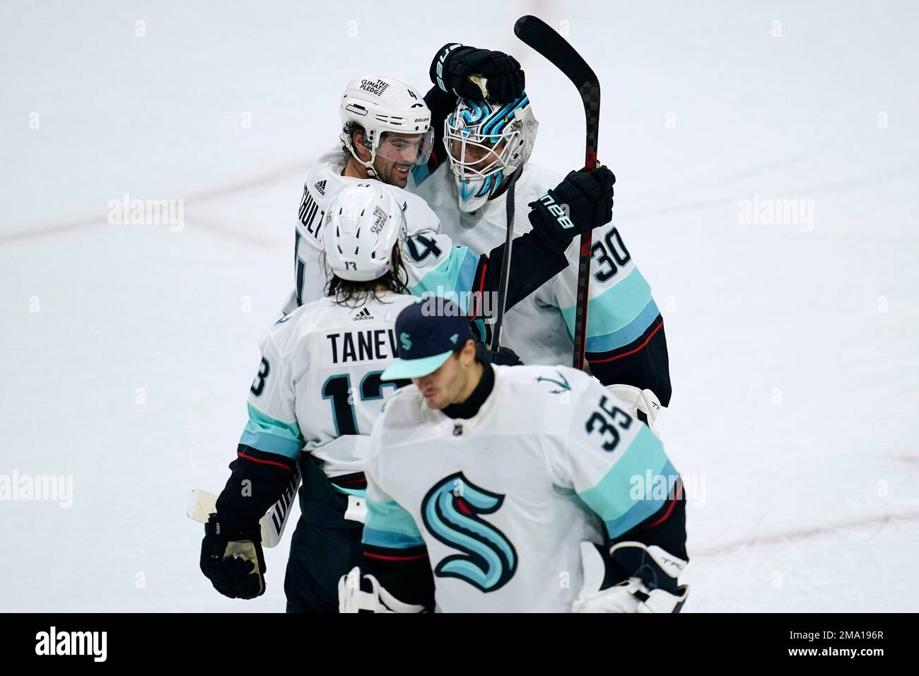 Seattle Kraken goaltender Martin Jones (30) celebrates with defenseman ...