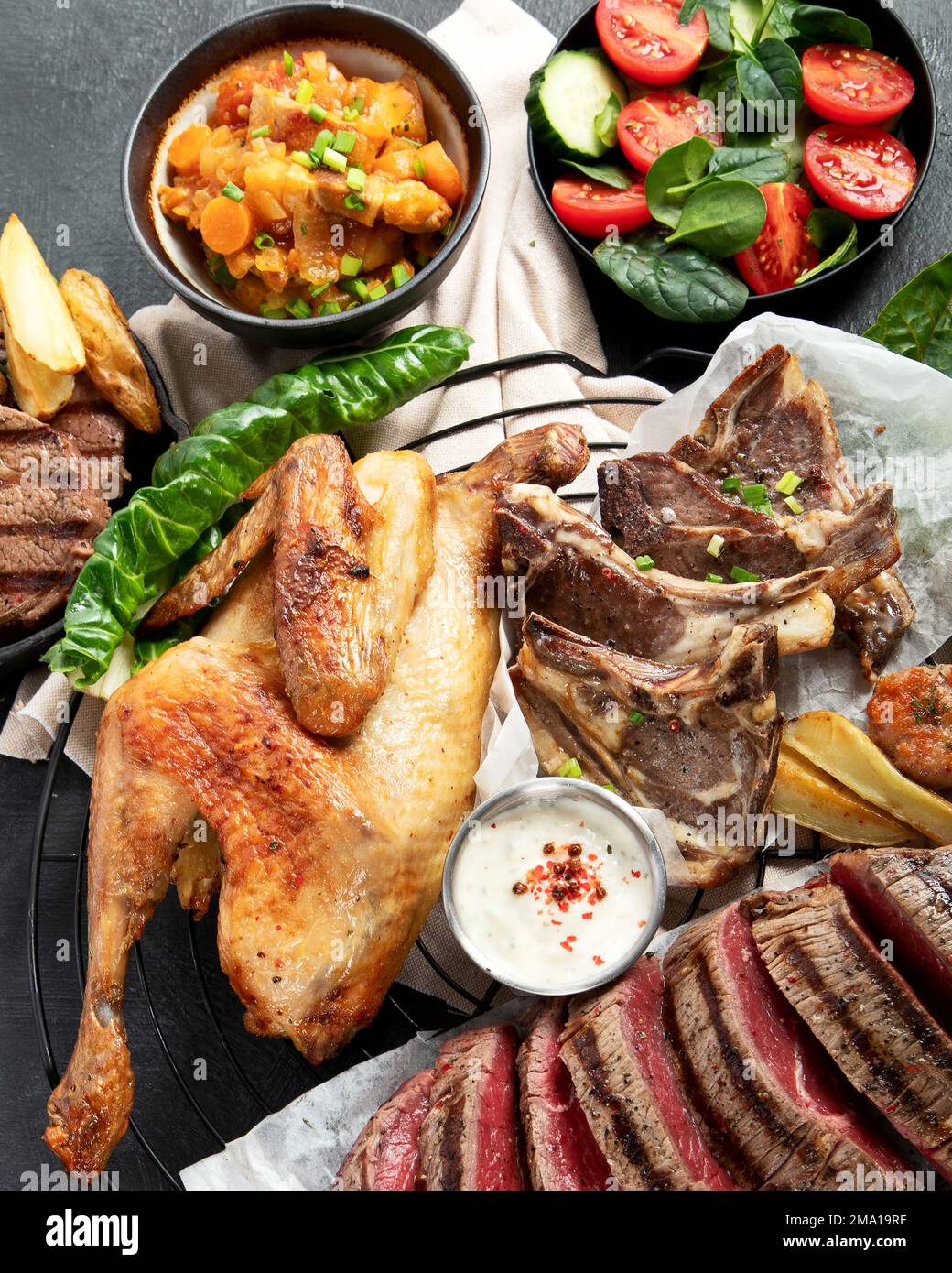 Various types of healthy cooked meat - beef, pork, chicken on a dark ...