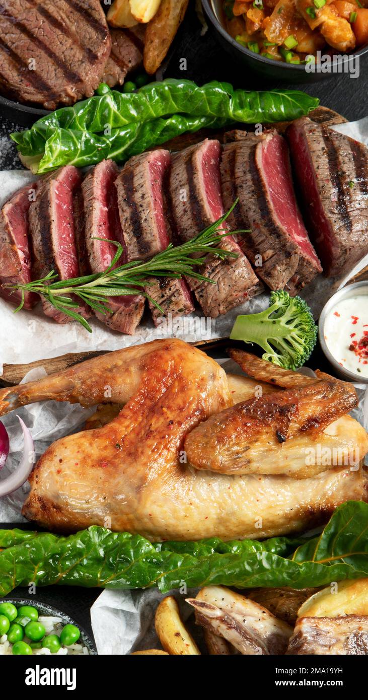 Various types of healthy cooked meat - beef, pork, chicken on a dark ...
