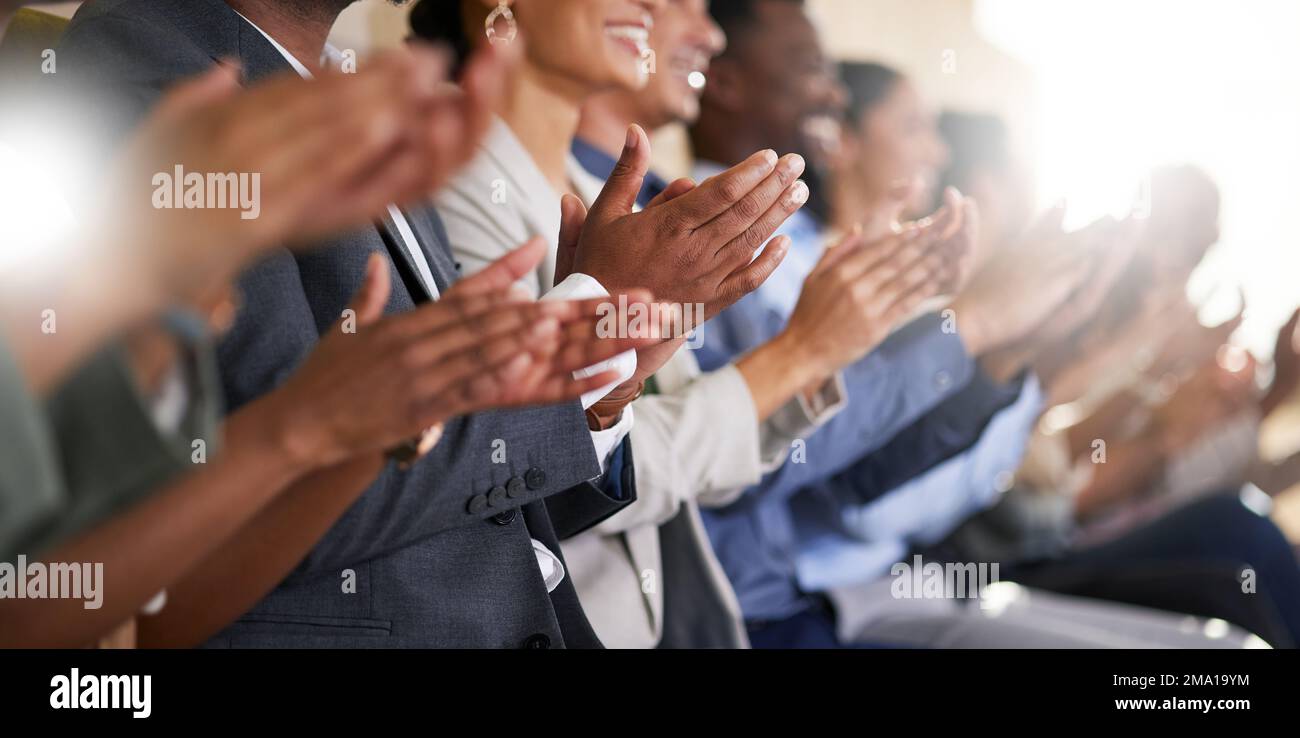 A round of applause. an unrecognizable diverse group of businesspeople ...