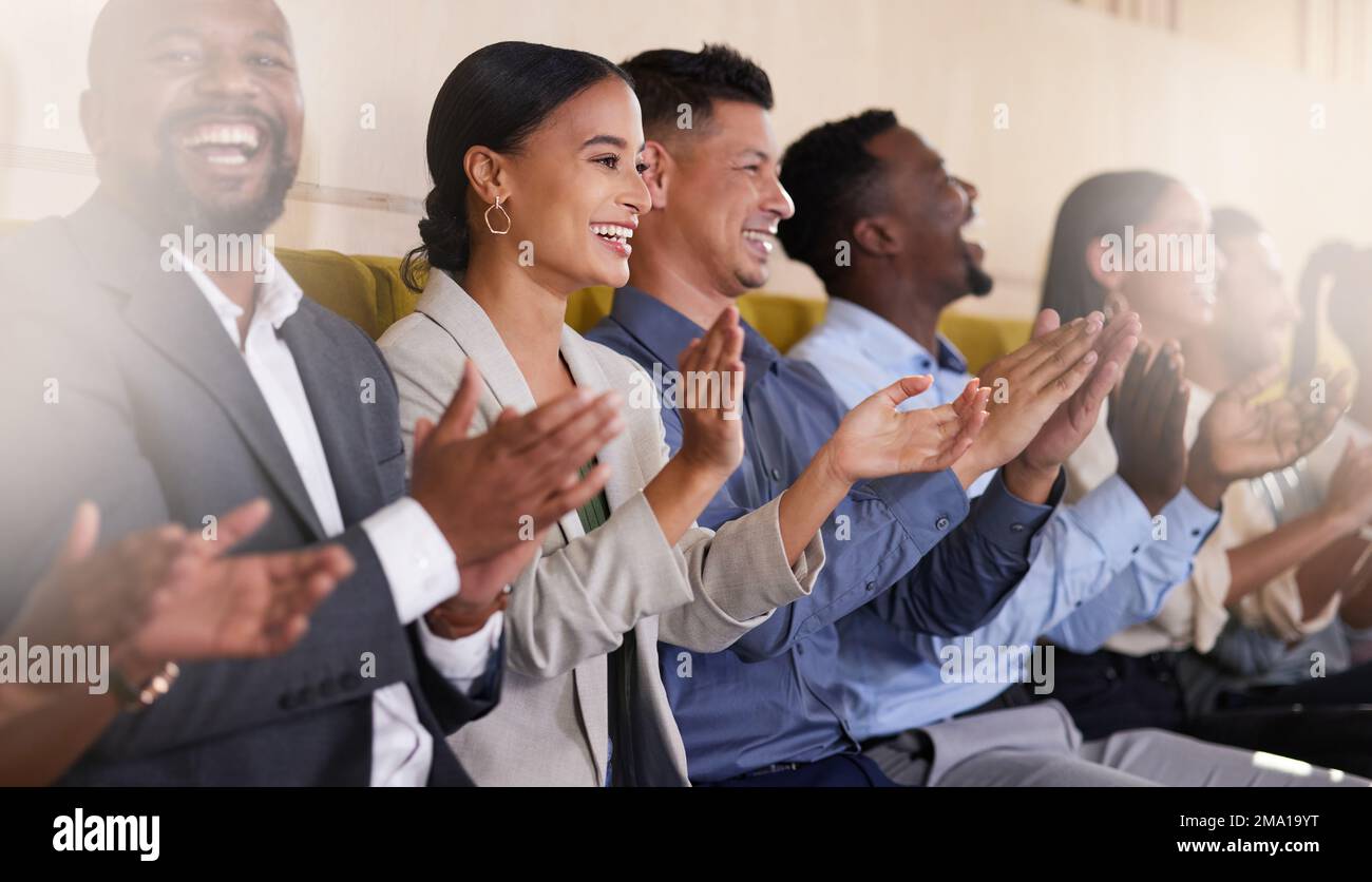 Well done, great job. a diverse group of businesspeople applauding ...