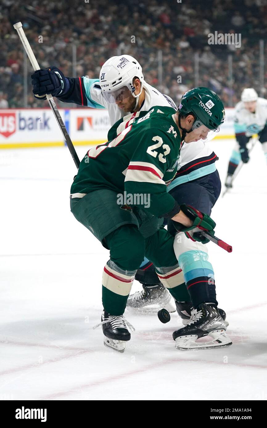 Minnesota Wild center Marco Rossi (23) and Seattle Kraken center Alex ...