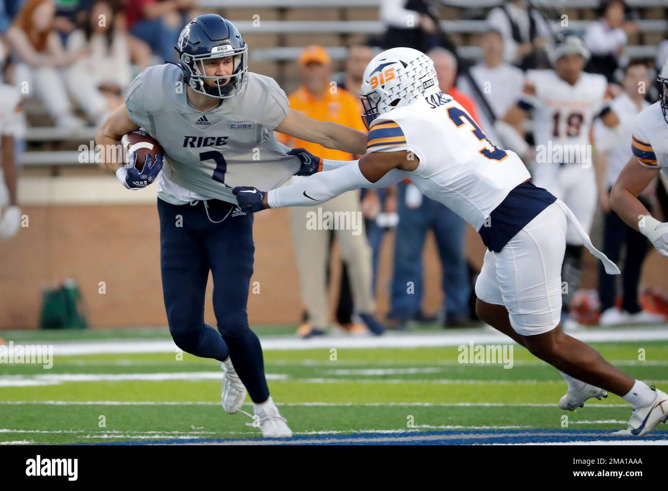 Rice wide receiver Bradley Rozner (2) pushes off the tackle attempt by ...