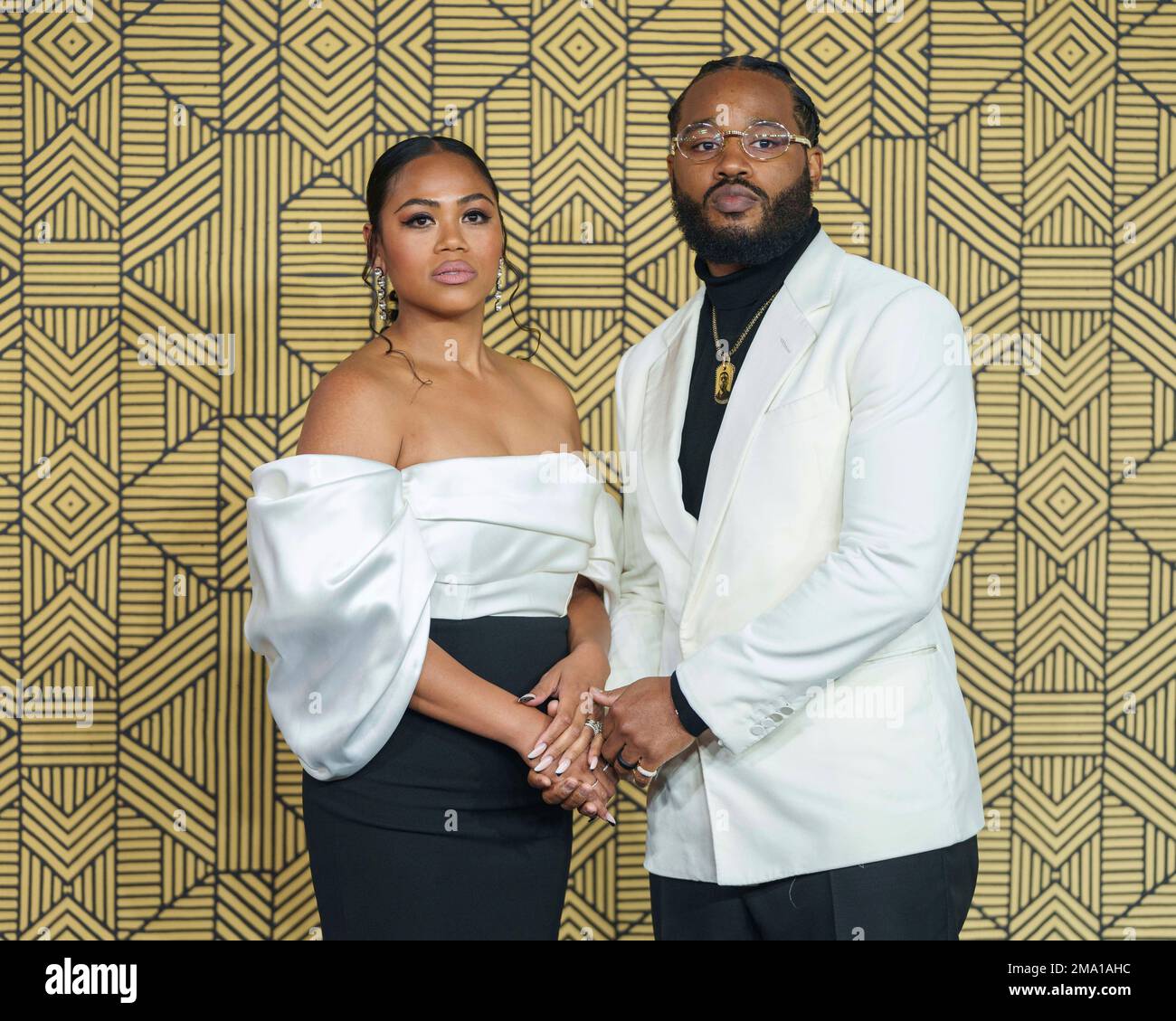 Zinzi Evans, left, and director Ryan Coogler pose for photographers ...