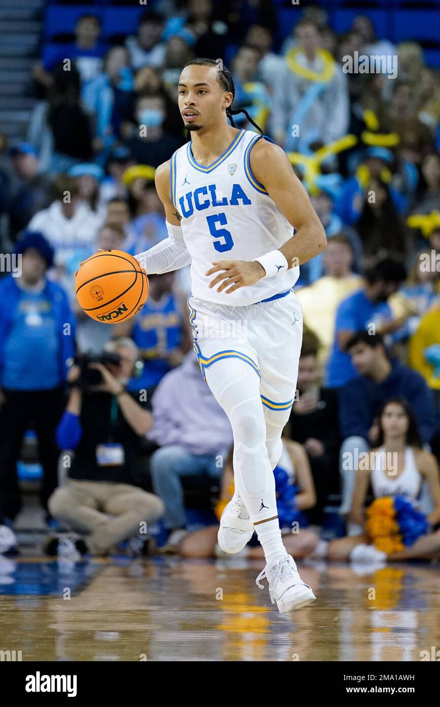 UCLA guard Amari Bailey (5) controls the ball during a college ...
