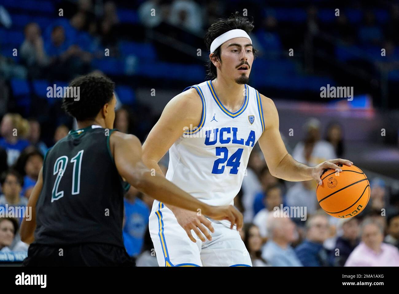 UCLA guard Jaime Jaquez Jr. (24) controls the ball during a college ...