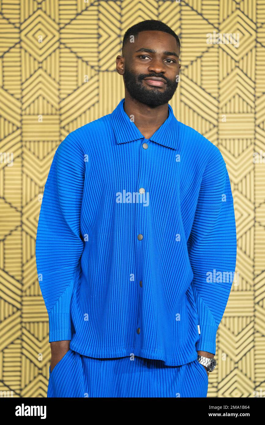 Santan Dave poses for photographers upon arrival for the premiere of ...