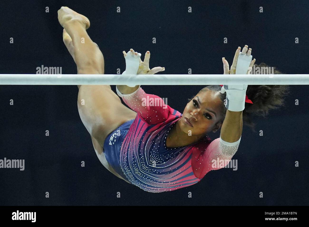 Shilese Jones of the U.S. competes on the uneven bars during the Women ...