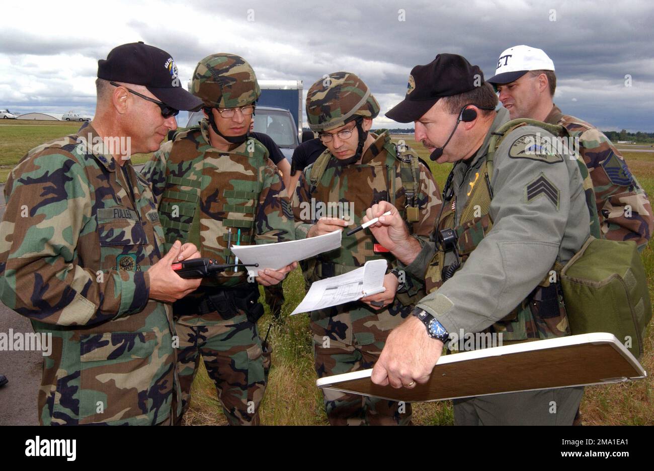 040611-F-0656B-005. [Complete] Scene Caption: Members of the McChord ...