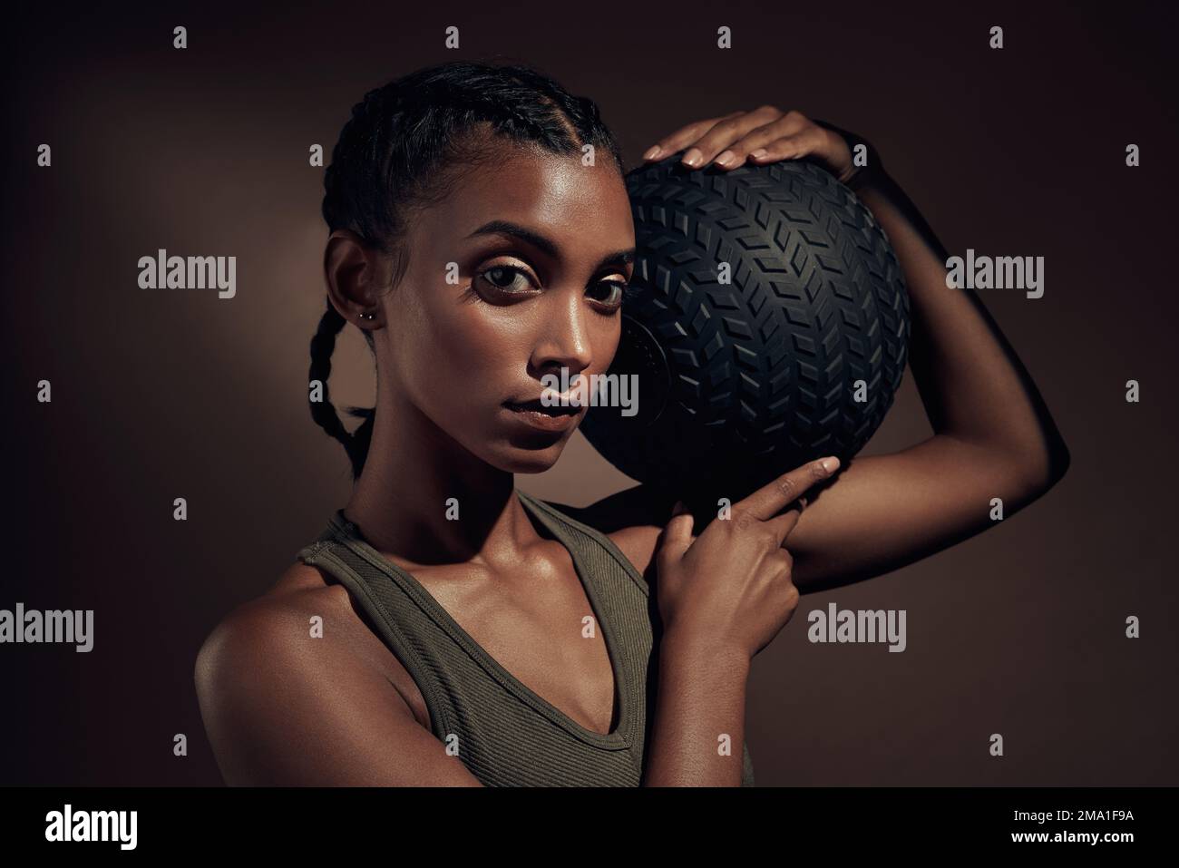 Too busy working for my dream body. an attractive young woman standing ...