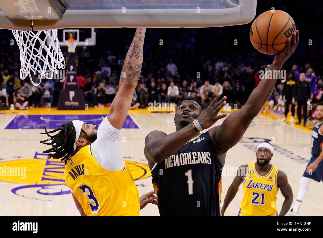 New Orleans Pelicans forward Zion Williamson, center, shoots as Los ...