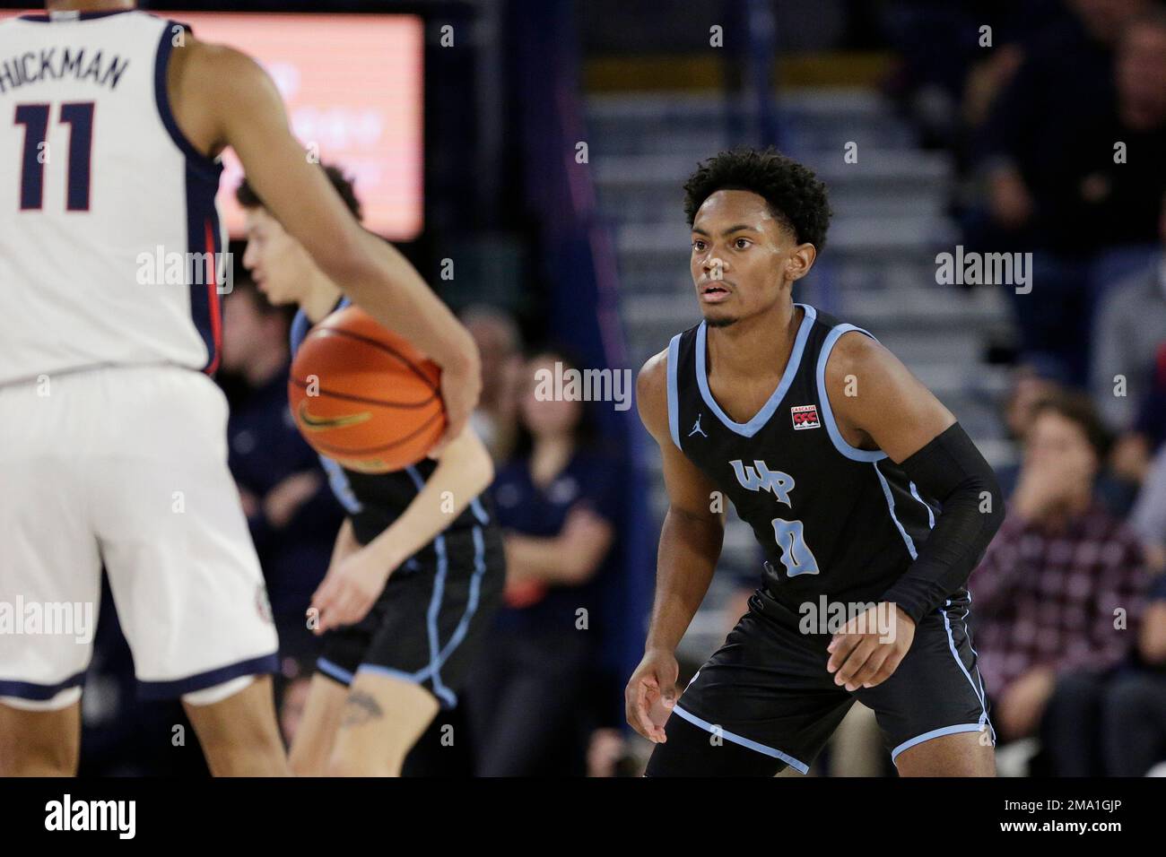 Warner Pacific guard Isaac Etter (0) defends Gonzaga guard Nolan ...