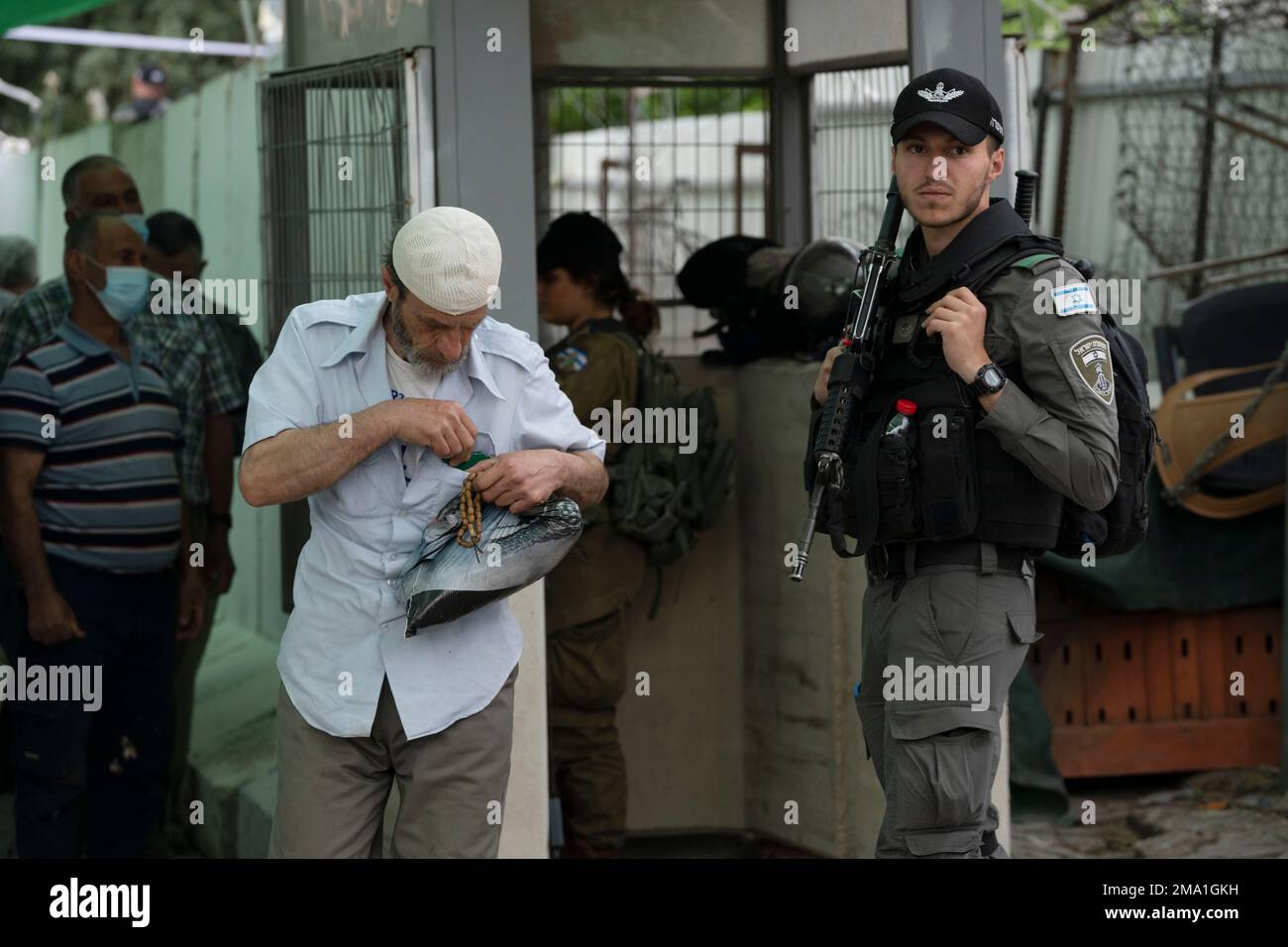FILE - An Israeli Border Police officer secures a checkpoint from the ...